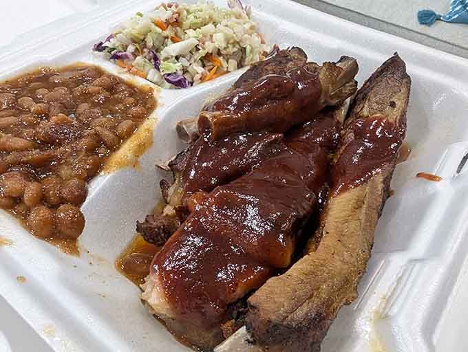 Spare ribs with beans and slaw on a styrofoam plate prove that great food doesn't need fine china, just proper respect for the smoking process.