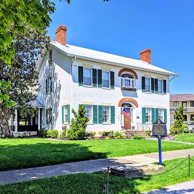 Classic American architecture at its finest: This pristine white house with green shutters embodies the timeless charm of historic Marietta.