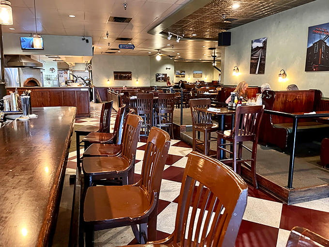The dining room where strangers become friends over shared appreciation for exceptional food and cold beer on tap.