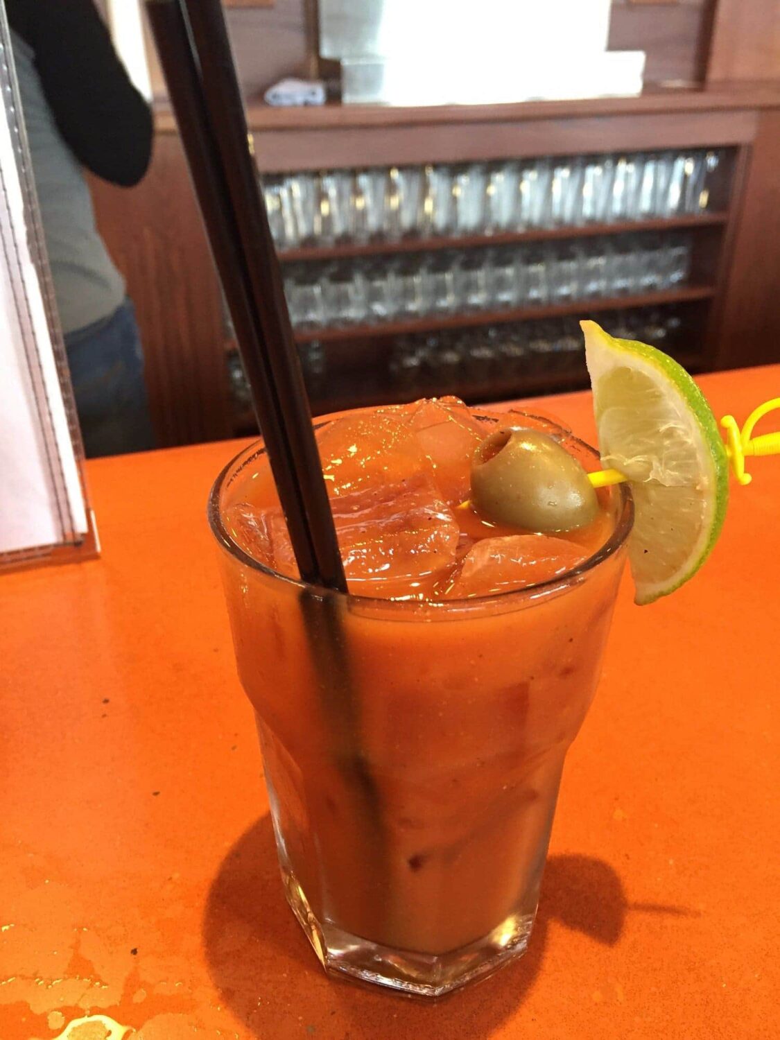 A Bloody Mary garnished to perfection, the ideal companion for a leisurely meal featuring those addictive sweet potato fries.