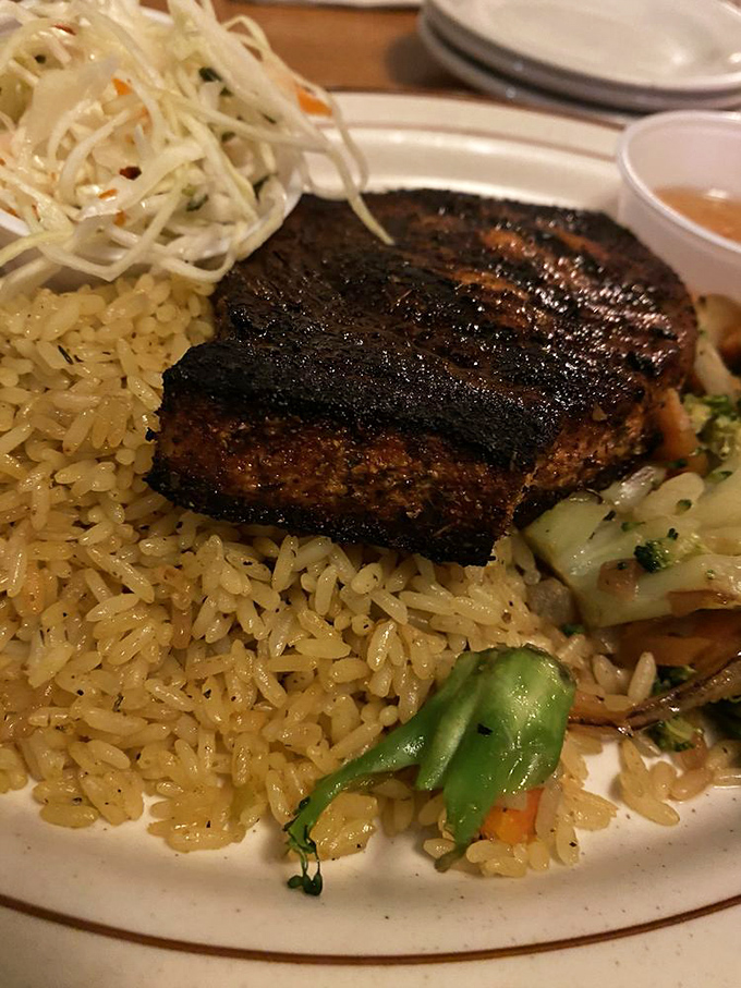 The blackened swordfish special showcases the kitchen's versatility beyond comfort food &ndash; perfectly seasoned crust outside, moist and flavorful inside.