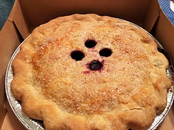 Classic blueberry pie gets the Poorhouse treatment &ndash; those steam vents aren't just functional, they're windows into berry paradise waiting inside.