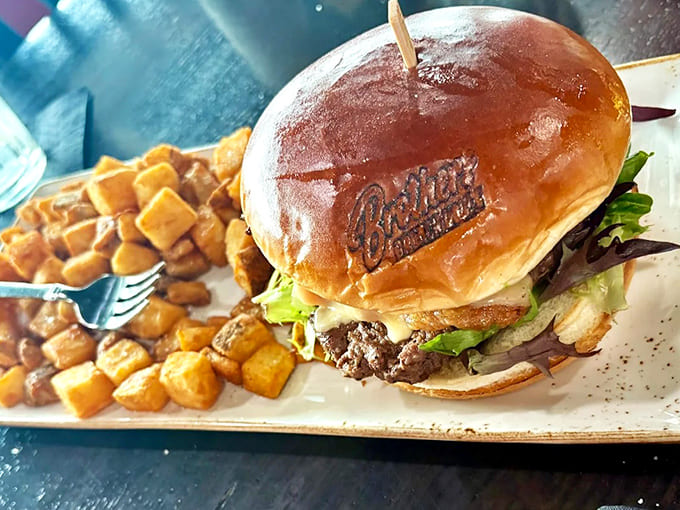 A burger that means business &ndash; hand-formed patty on a branded brioche bun with crispy potatoes that'll make you forget about regular fries.
