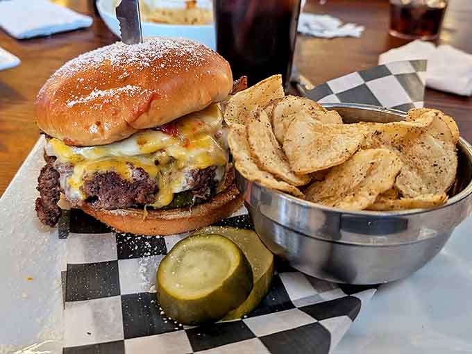 The burger arrives like a challenge &ndash; substantial, perfectly charred, and accompanied by house-made chips that shatter satisfyingly between your teeth.