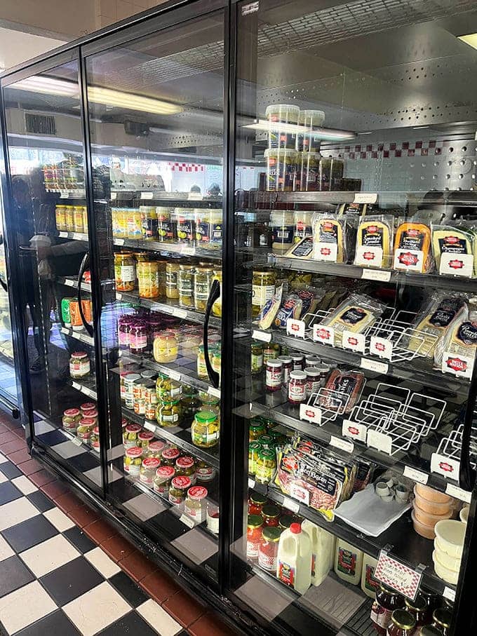 The refrigerated retail section is stocked with imported cheeses, gourmet goodies, and everything you need for a feast.