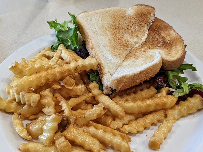 Golden-toasted bread hugging fresh greens and savory chicken &ndash; proof that sandwiches don't need fourteen ingredients to shine.