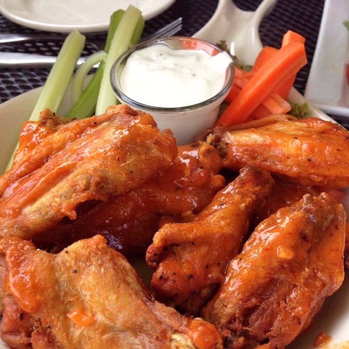 These wings aren't messing around&mdash;perfectly glazed and ready for their close-up, with crisp vegetables playing backup.