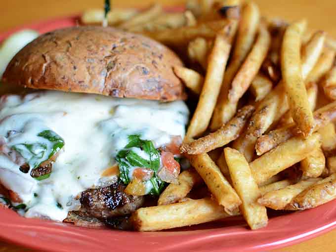 Even the burgers here come with perfectly golden fries, because this place refuses to do anything halfway.