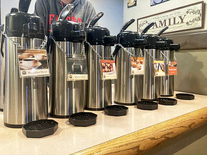 Coffee dispensers lined up like soldiers ready for duty, each promising a different flavor adventure to complement your bagel selection.