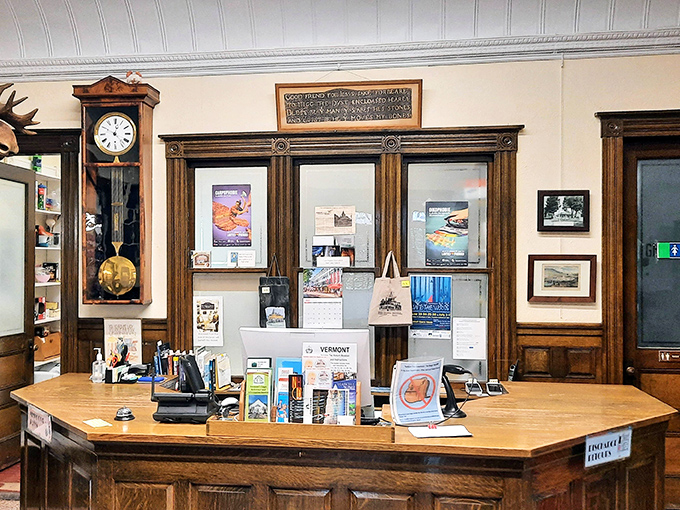 The circulation desk stands ready for service, its vintage woodwork and brass details telling stories of countless books that have traveled between two countries.