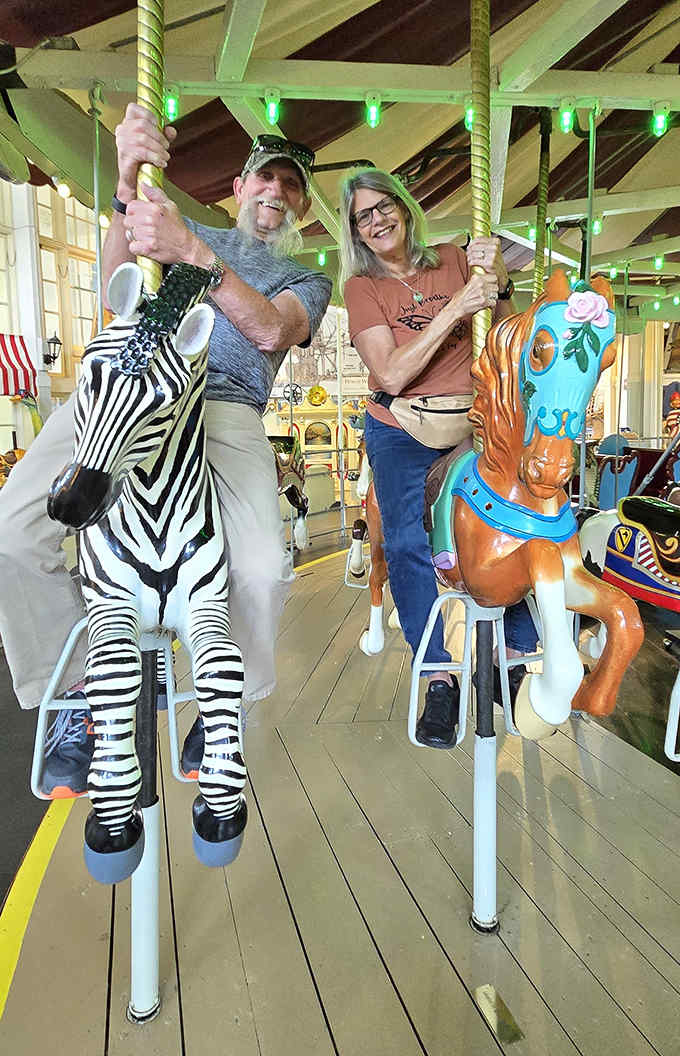 Proving you're never too old for carousel magic &ndash; these riders have graduated from "holding on for dear life" to "casual one-handed pose."