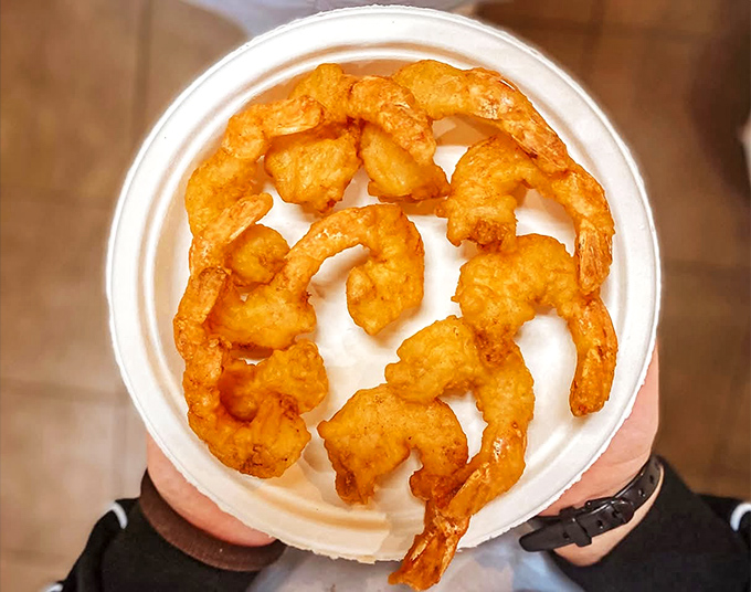 These crispy shrimp wear their golden batter like royal robes &ndash; crunchy exterior giving way to perfectly cooked seafood that needs no passport to impress.