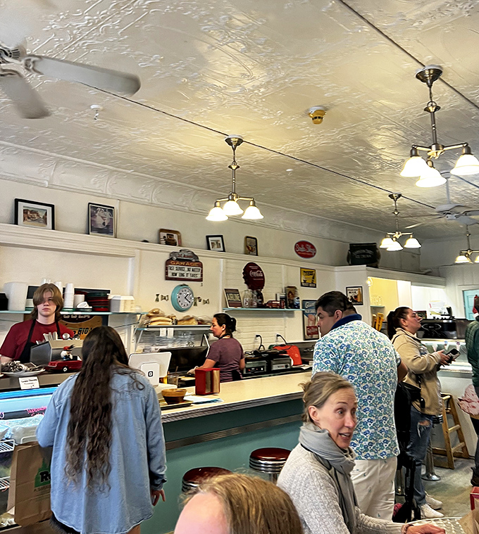 The bustling counter during peak hours &ndash; where ice cream dreams come true and friendly staff navigate the choreography of scoops and smiles.