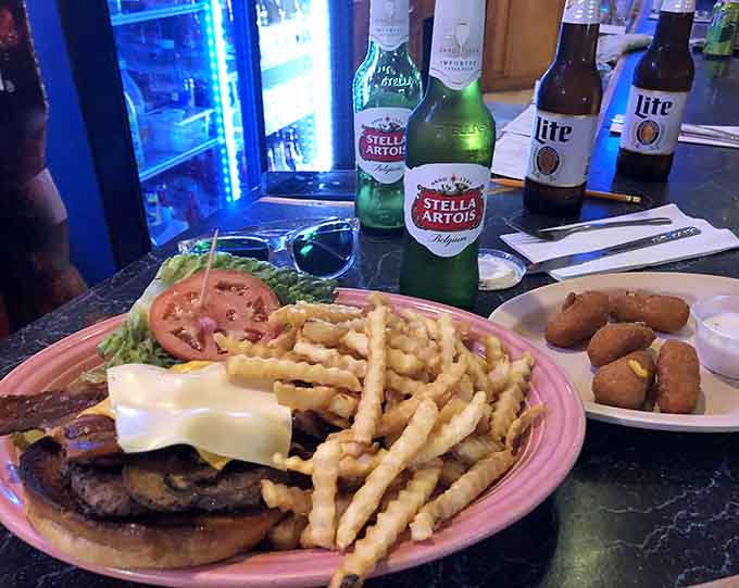 Even the burgers here are no joke, stacked high with toppings and served with fries that disappear faster than you'd expect.