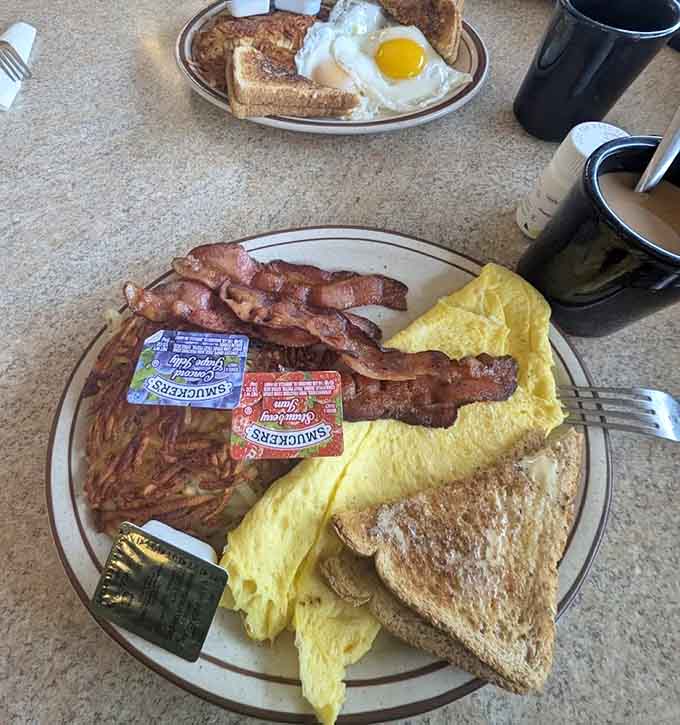 A breakfast plate that looks like it stepped out of a Norman Rockwell painting, complete with crispy bacon and perfectly cooked eggs.