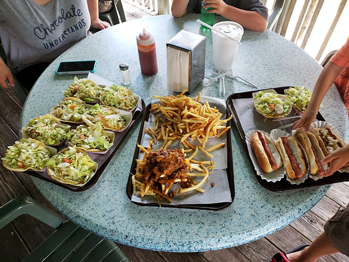 A smorgasbord of delights! This spread is like a greatest hits album for your mouth, featuring chart-toppers from dogs to tacos.