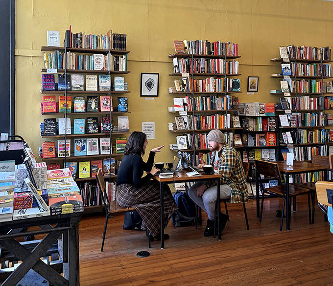 Patrons find their own rhythm in this literary haven, where conversations bloom between strangers connected by books and baked goods.
