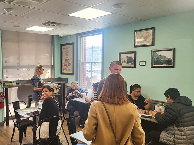 Happy customers fill the cozy seating area, each face bearing that unmistakable expression of people who've just discovered something worth writing home about.