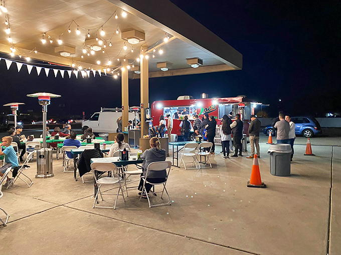 Night falls, but the taco party's just getting started. These diners know that good food tastes even better under twinkling lights.