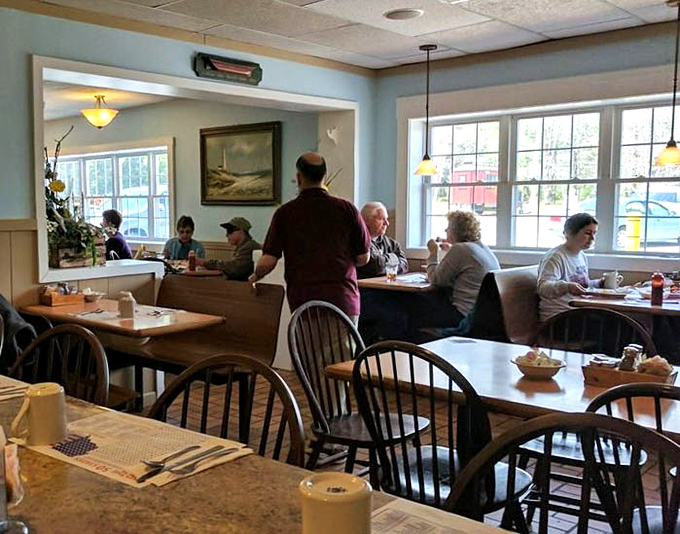 Inside, patrons linger over steaming cups of coffee, sharing stories and laughter, transported to a simpler time before smartphones stole the conversation.