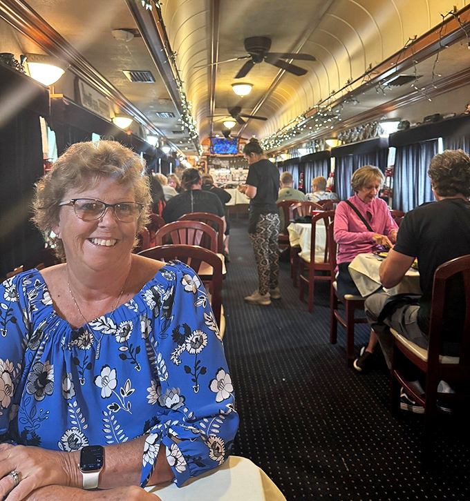 Happy patrons enjoying the unique railroad ambiance. Every meal comes with a side of nostalgia and genuine smiles.