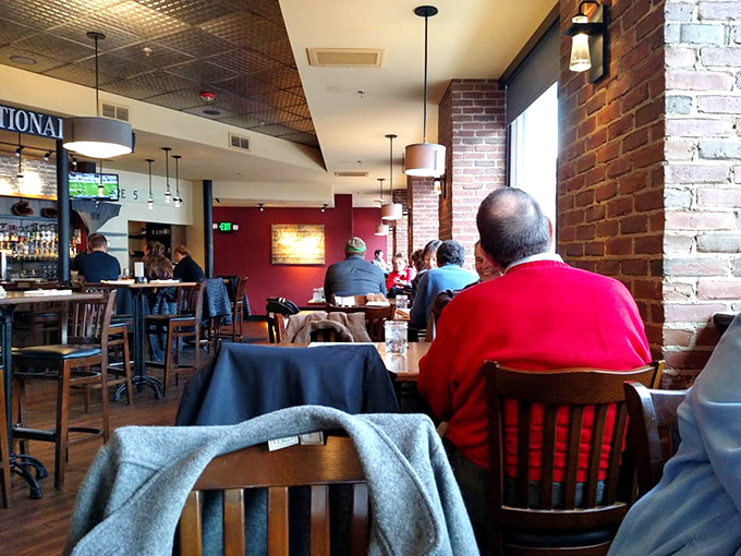 Cornerstone&rsquo;s dining room blends warm wood and brick, creating a cozy, welcoming space for meals and conversation.