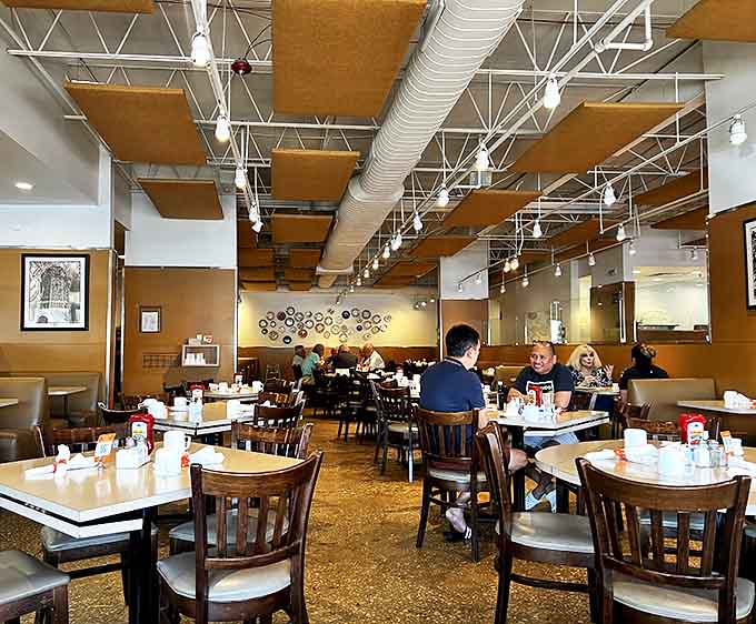 Diners: Where breakfast dreams and lively conversation merge in a sunlit space that somehow feels both spacious and cozy at once.