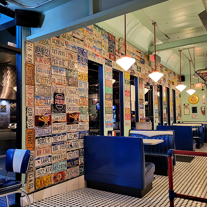 License plates from across America create a patchwork of road trip memories on walls that have witnessed countless happy meals.