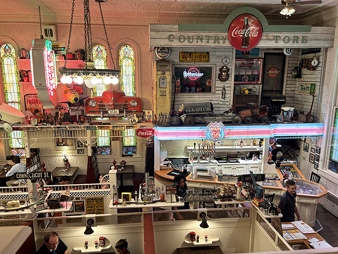 From this bird's-eye view, the restaurant reveals itself as a living museum of Americana, with neon signs illuminating happy diners below.