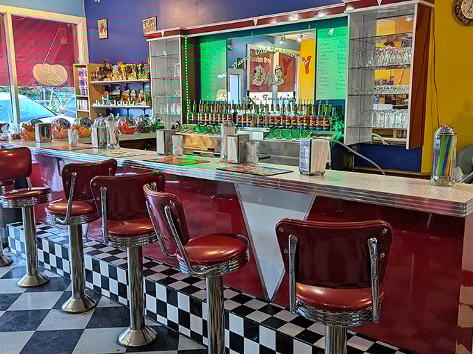 Dining Area: Those cherry-red stools aren't just seating&mdash;they're time machines transporting you to an era when "social media" meant sharing the newspaper.