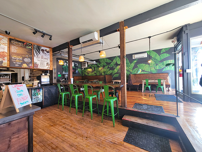 Dining Area: Tropical leaf murals and warm wooden elements create an oasis where Maine meets Latin America in perfect harmony.