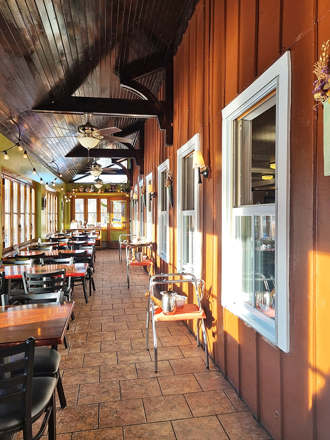 The sun-drenched enclosed porch offers year-round dining with seasonal views that change like Vermont's famous foliage.