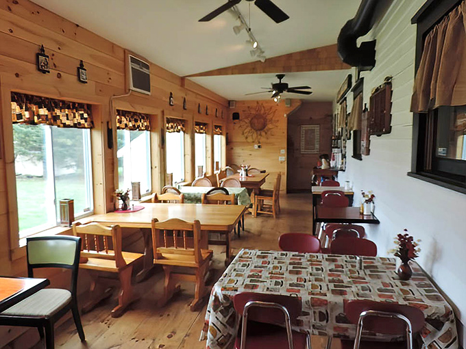 Warm wood paneling and simple furnishings create the cozy dining area &ndash; like eating in your favorite aunt's country kitchen.
