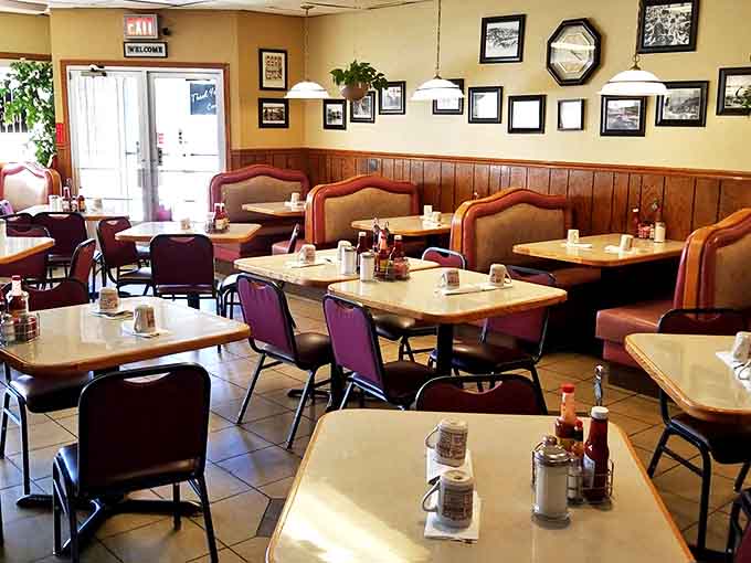 Ray's dining area balances comfort and function with booths lining wood-paneled walls where countless breakfast conversations have unfolded.
