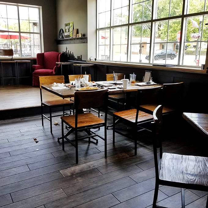 Large windows flood the dining room with natural light, making everything look Instagram-worthy without even trying.