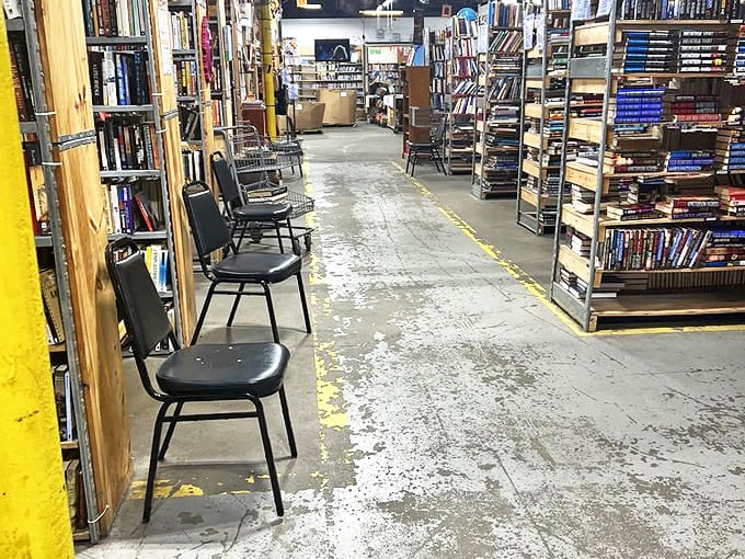 Simple chairs invite browsers to pause and sample potential purchases. The best bookstores understand reading is never a rushed affair.