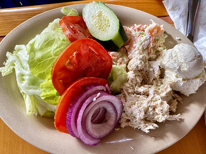 Garden-fresh veggies frame creamy tuna salad – proof that "eating light" doesn't mean sacrificing flavor or satisfaction.