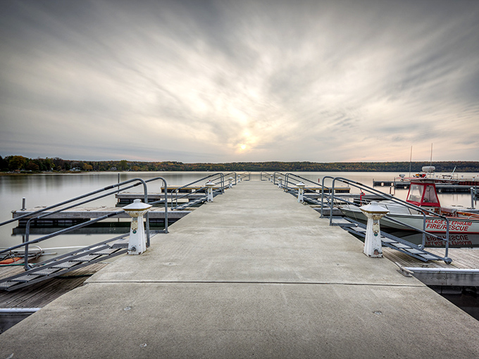 Eagle Harbor's marina at dusk &ndash; when boats rest easy and the water turns to glass, reflecting Wisconsin's perfect summer sky.