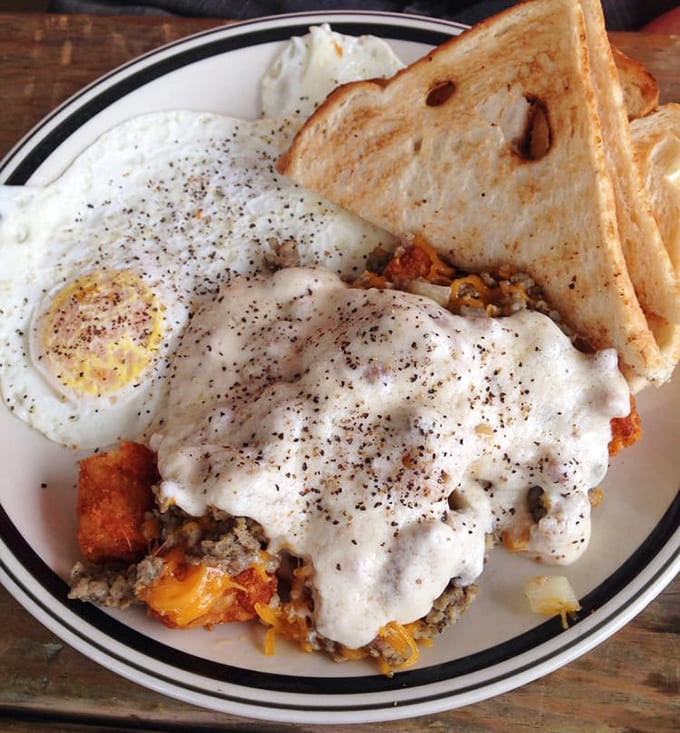 The Tot Stack defies gravity and good sense in the best possible way, piling breakfast components like edible Jenga for champions.
