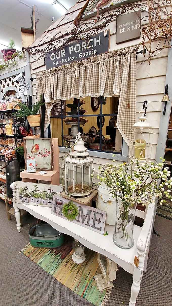 This charming porch display makes you want to sit a spell, maybe with some sweet tea and gossip &ndash; porch sitting elevated to an art form.