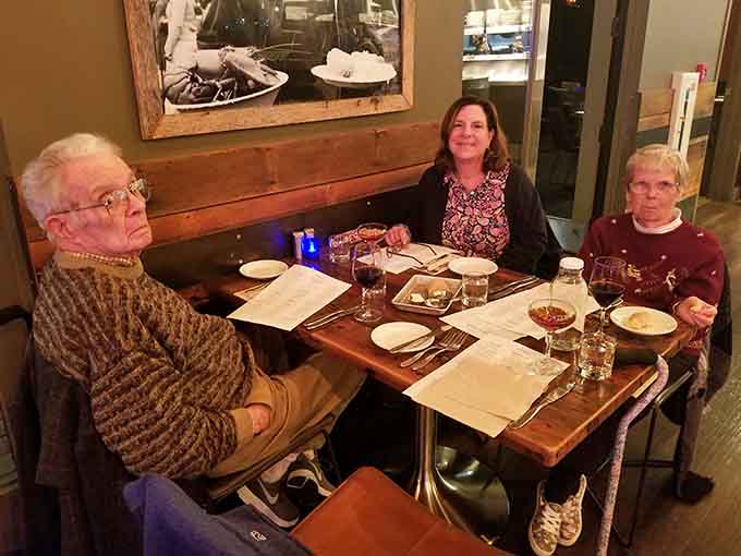 Happy diners enjoying their meal proves that good food brings people together, creating memories one delicious bite at a time.