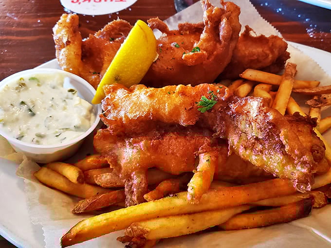 Golden-battered fish and chips that could hold their own in any coastal town, crispy outside and tender inside with perfect fries.
