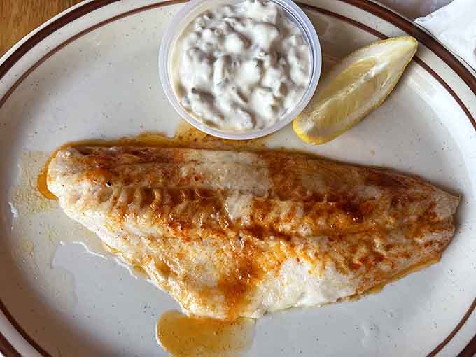 The fish fillet showcases Florio's commitment to quality seafood, perfectly cooked and simply presented with lemon and tartar sauce.
