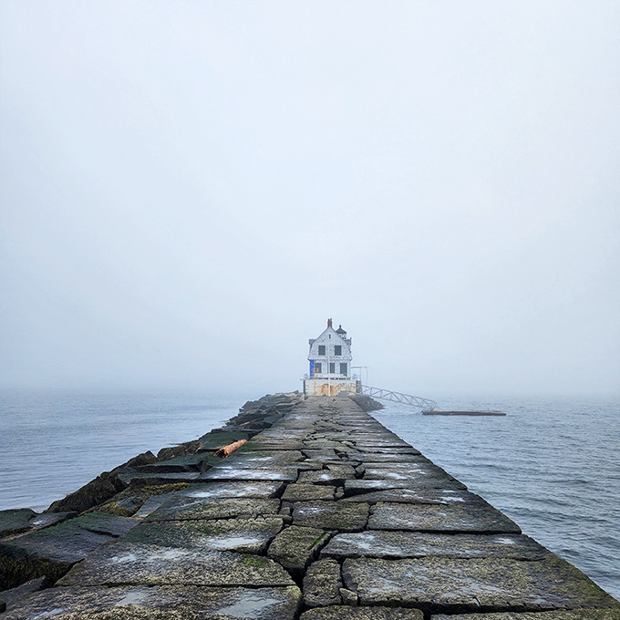 On foggy days, the lighthouse emerges from the mist like a ghost ship, demonstrating exactly why these beacons were so essential to navigation.