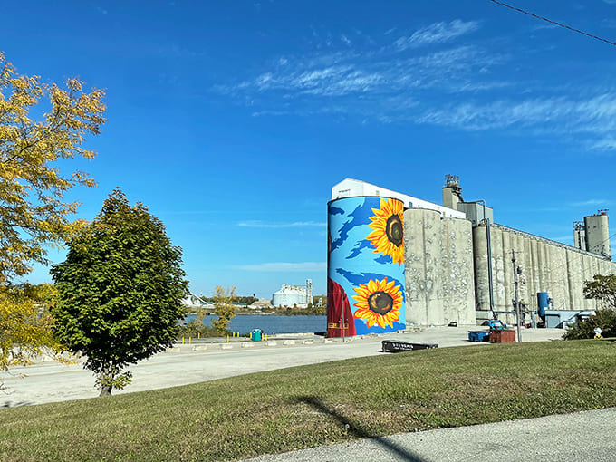 Autumn adds its own palette to the scene, with fall colors providing a natural complement to the painted sunflowers and portraits.