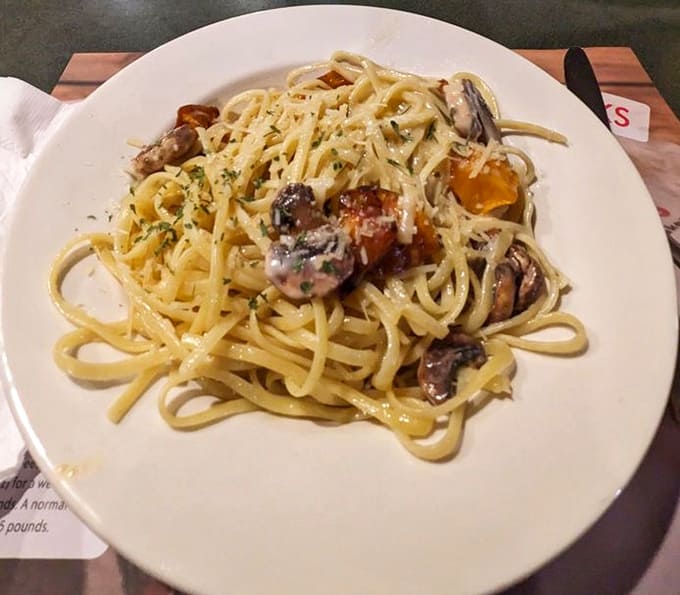 Fresh pasta with mushrooms and a generous coating of cheese demonstrates that Italian-American comfort food is alive and well here.