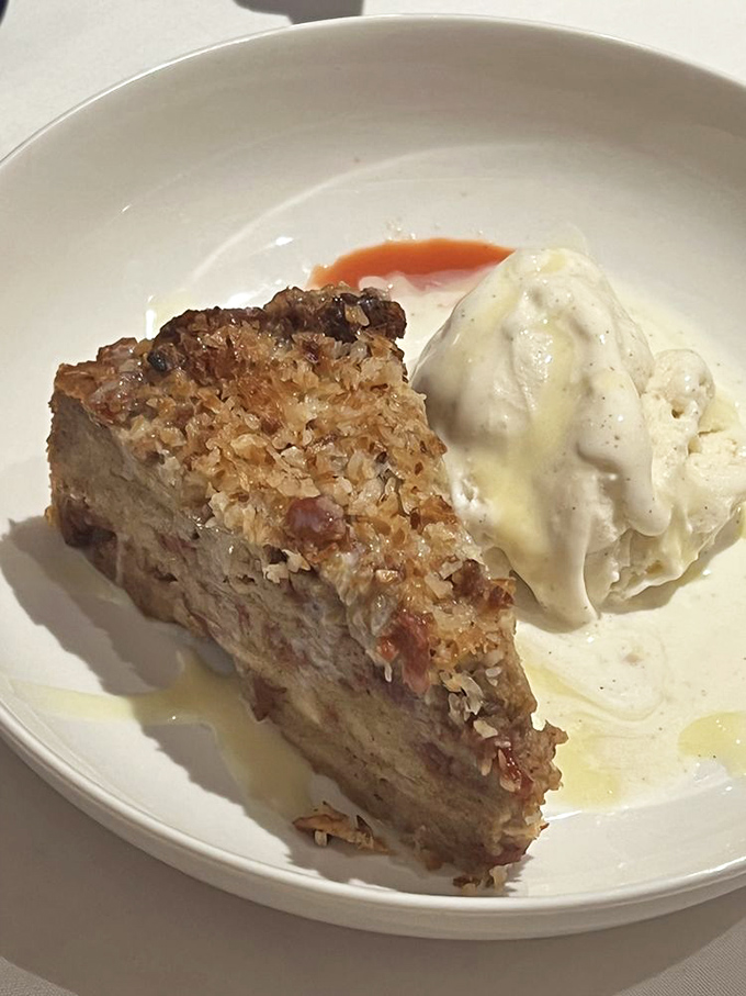 Guava Bread Pudding proves that comfort desserts can have tropical flair, especially with that slowly melting scoop of vanilla ice cream.