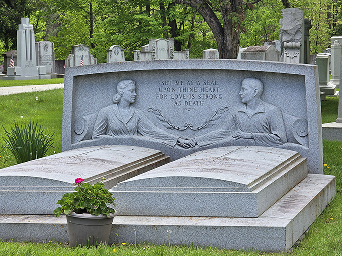 "Set me as a seal upon thine heart" &ndash; this touching double monument captures eternal love with hands reaching across granite pillows.