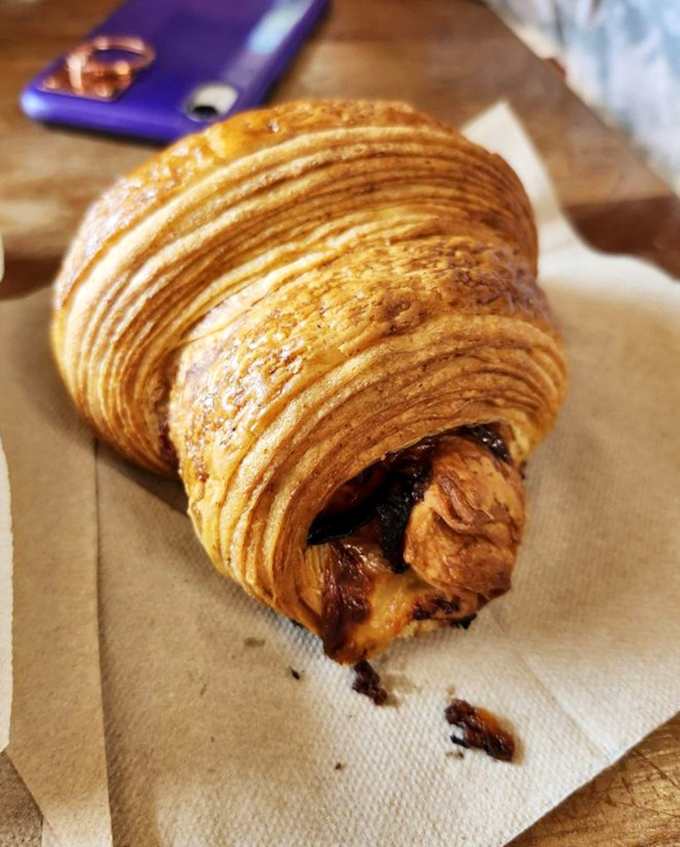 Layers upon buttery layers of pastry perfection cradle ham and cheese in what might be the most dignified way to start your day.