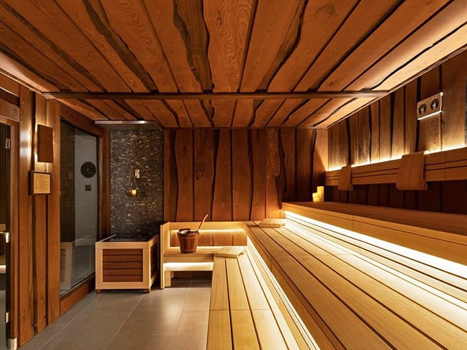 Sauna Room: Wood-lined heat chamber where Wisconsinites can finally thaw out while pretending they're in Finland instead.